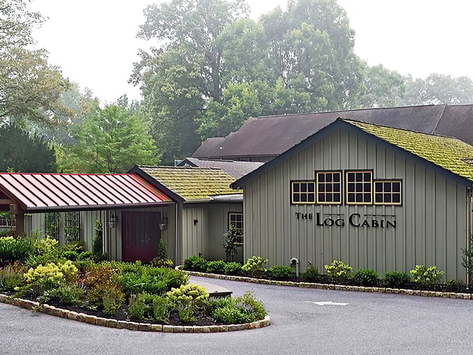 The Log Cabin's exterior blends seamlessly with its woodland surroundings, like a storybook restaurant that materialized from your fondest dining fantasies.