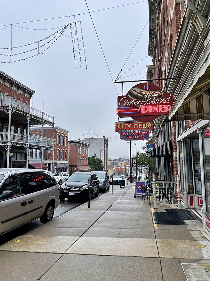 The iconic red Coney Island Diner sign stands as a beacon of comfort food on Mansfield's historic Main Street, promising nostalgic flavors and hometown hospitality.