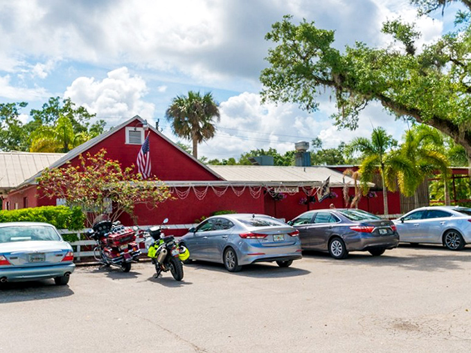 A slice of Americana painted fire-engine red, Alva Country Diner stands proudly against Florida's blue sky, beckoning hungry travelers with the promise of comfort food.