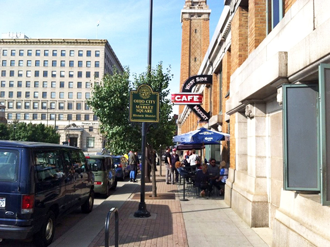 The iconic clock tower of Ohio City Market Square stands sentinel over the West Side Market Caf&eacute;, promising culinary adventures within those brick walls.