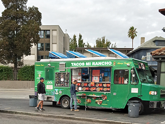The emerald-green chariot of culinary dreams sits ready for action. Tacos Mi Rancho's vibrant food truck promises Mexican delights that'll make your taste buds stand at attention.