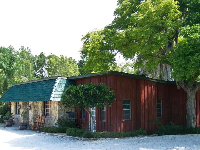 Rustic charm meets culinary excellence at this unassuming roadside gem. The red wooden exterior and stone facade promise authentic Florida country dining.