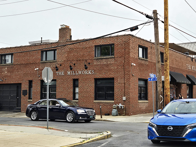 The unassuming brick exterior of The Millworks belies the culinary wonderland within. Like finding a secret door to Narnia, but with better pizza.