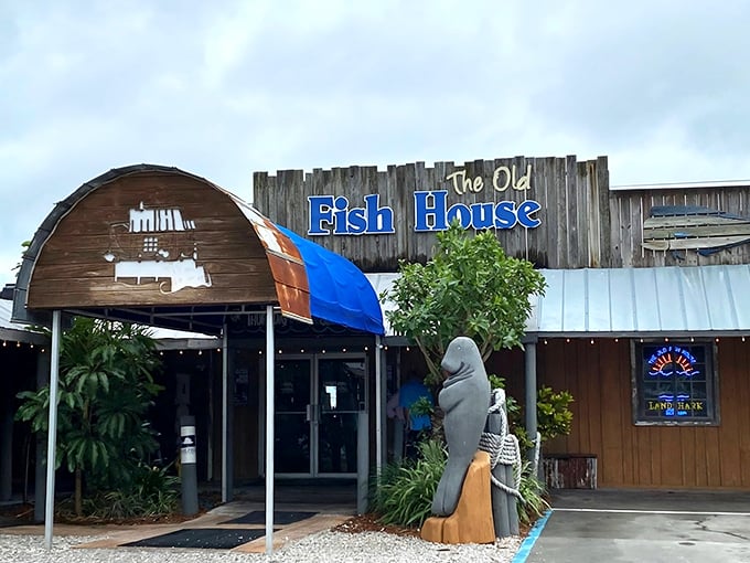 That weathered wooden charm whispers "authentic seafood paradise" before you even step inside this coastal treasure.