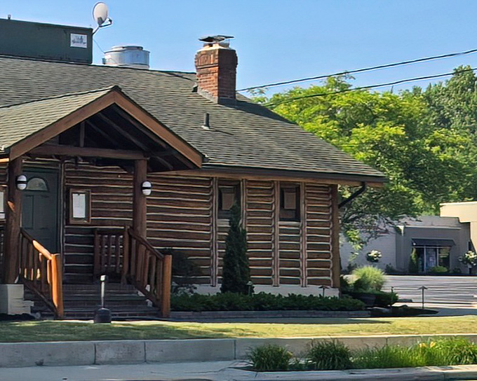 The log cabin exterior isn't just rustic charm&mdash;it's a promise of what awaits inside: warmth, comfort, and steaks that'll make you forget your name.