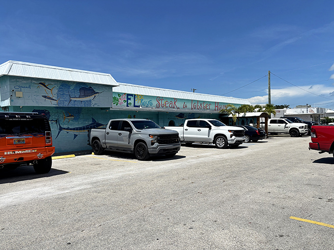 The turquoise exterior isn't just Florida kitsch&mdash;it's a maritime beacon for hungry travelers. Painted fish swim eternally across walls that have witnessed countless seafood pilgrimages.