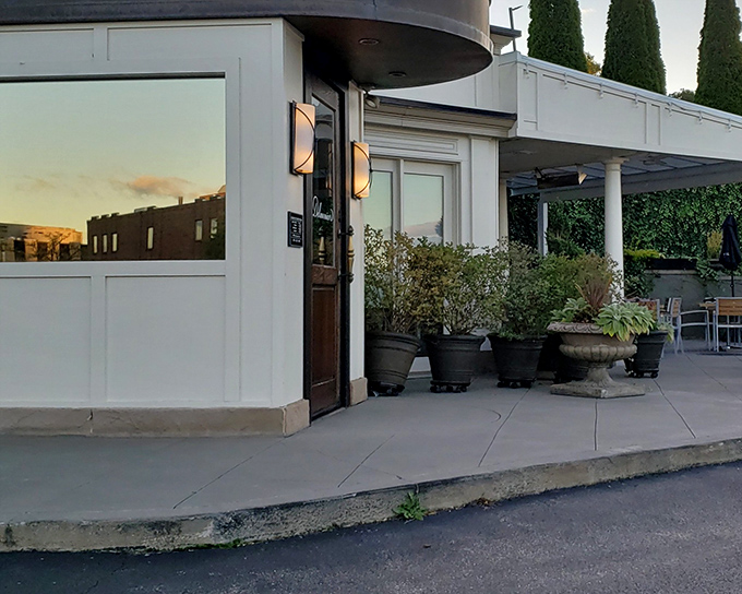 The unassuming exterior of Delmonico's belies the culinary magic happening inside, like finding a treasure chest disguised as a mailbox.