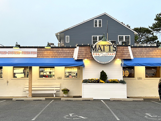 The blue-gray exterior of Matt's Fish Camp beckons like a coastal lighthouse for the hungry, promising seafood treasures within those weathered walls.