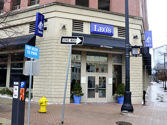 Leo's blue signage stands out like a maritime beacon in downtown Grand Rapids, promising seafood salvation hundreds of miles from any coast.