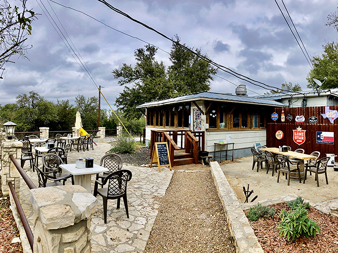 The humble exterior of Alamo Springs Caf&eacute; belies the culinary treasures within. Texas Hill Country magic awaits on this rustic patio.