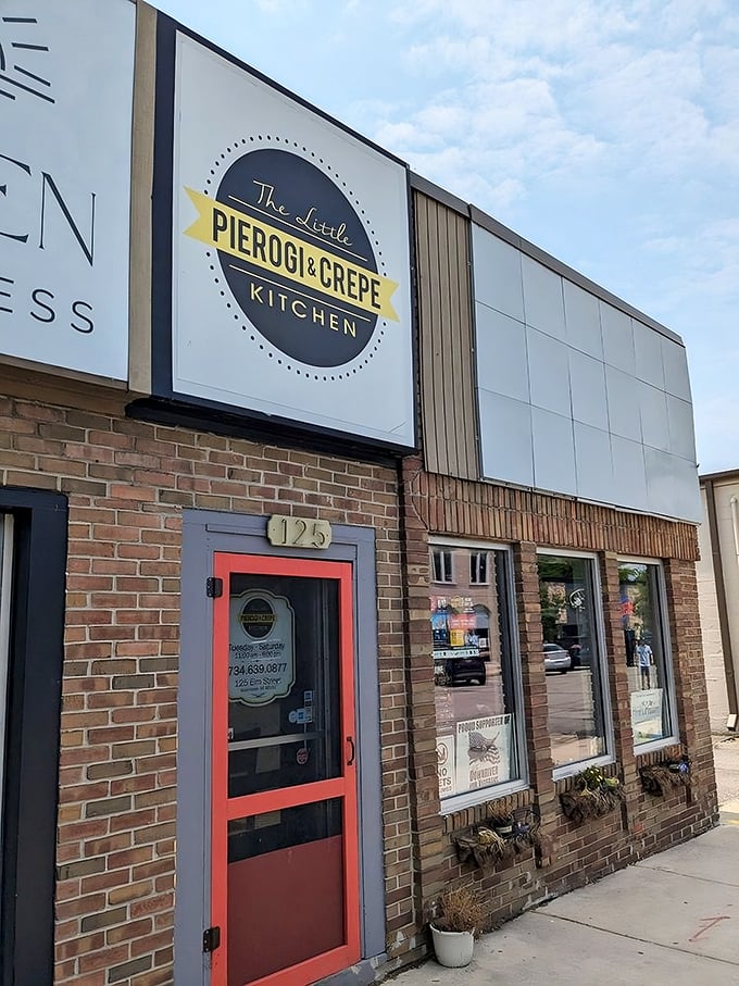 The bright yellow door beckons like a culinary lighthouse, promising Eastern European comfort and French finesse in downtown Wyandotte.