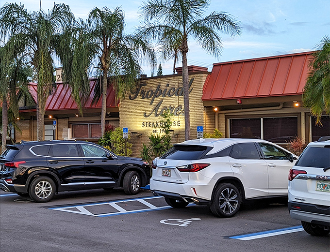 Don't let the modest exterior fool you—behind the brick and red roof of Tropical Acres Steakhouse lies one of Fort Lauderdale's most beloved spots, where steak legends have been made for generations