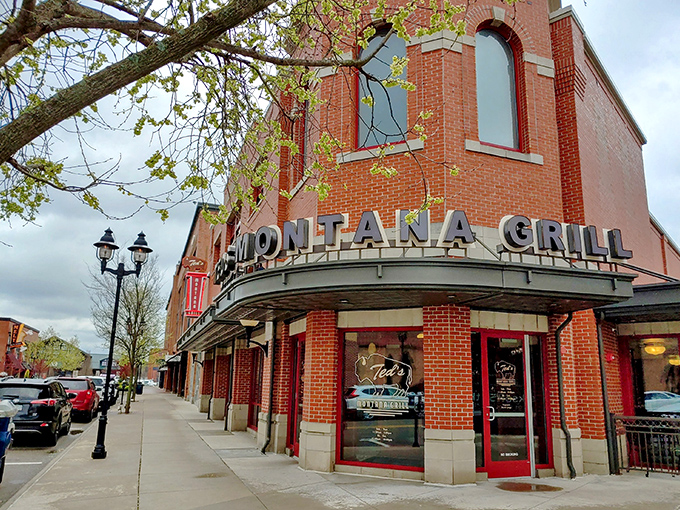 The corner brick building stands proud like a frontier outpost in modern Columbus, its "MONTANA GRILL" sign practically shouting "come get comfortable!"