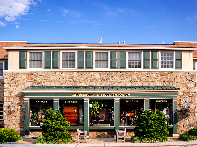 The stone facade of Middleburg Antique Emporium stands like a time portal in Virginia horse country, promising treasures behind those gleaming green-trimmed windows.