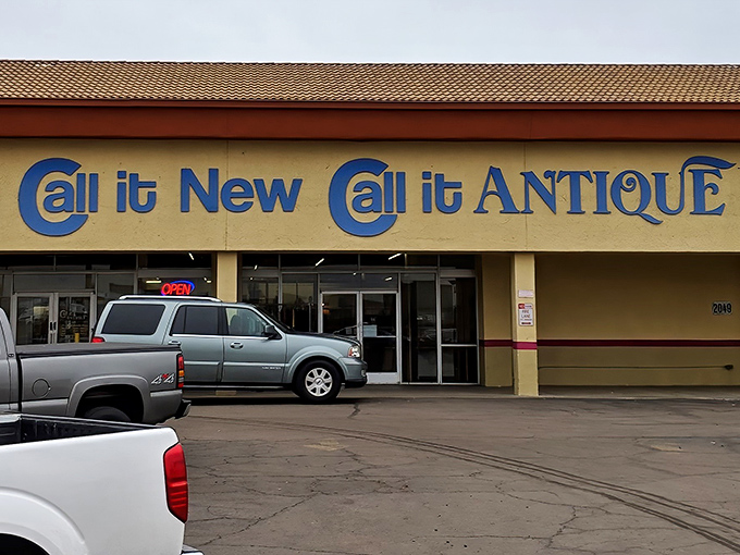 The unassuming storefront of Call it New / Call it Antique beckons with its bright blue signage, promising treasures that span decades of American life.