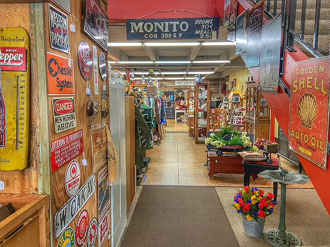 Vintage signs line the entrance corridor like a time-travel portal. Dr. Pepper thermometers and Shell Oil memorabilia welcome you to a wonderland of nostalgia.
