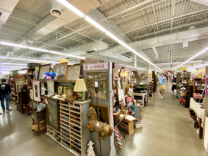 Treasure hunters navigate the well-organized aisles of Antiques Village, where each booth feels like stepping into someone else's carefully curated memories.