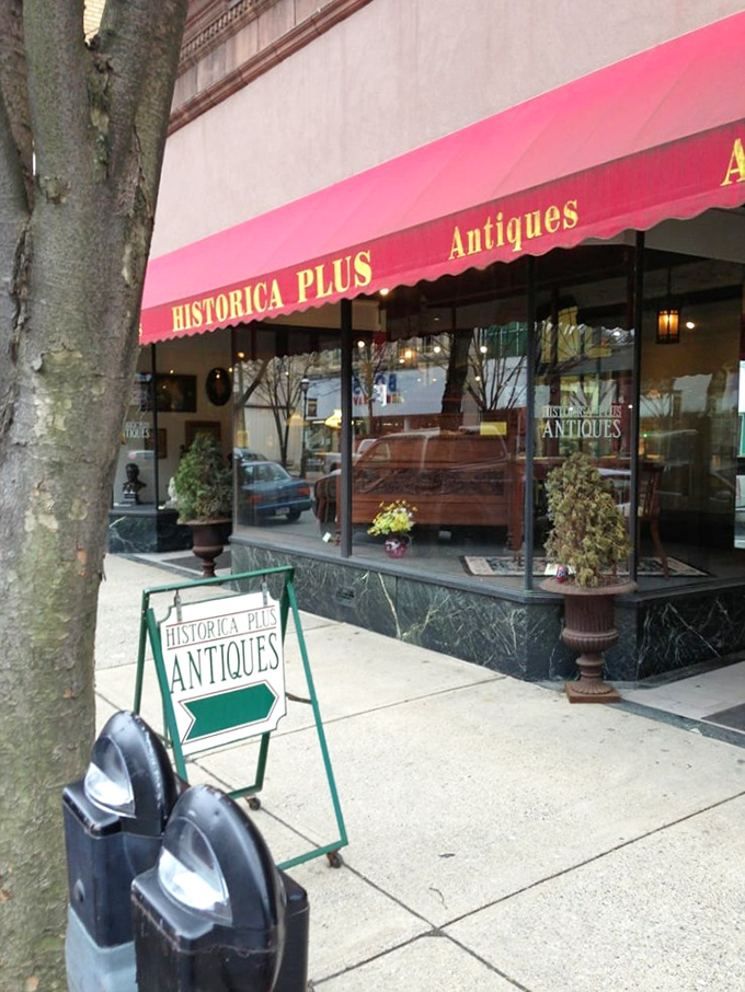 The iconic red awning of Historica Plus beckons treasure hunters like a vintage lighthouse guiding ships to shore. Pennsylvania antiquing at its finest.