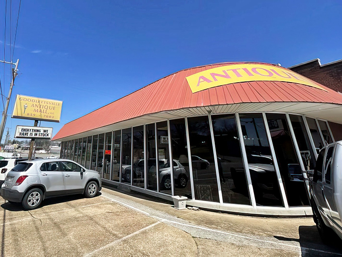 The distinctive red-roofed exterior with its bold yellow "ANTIQUE" sign practically screams, "Come in, we have cool stuff you didn't know you needed!"