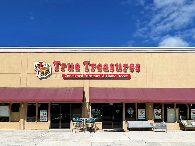 The storefront beckons with its bold red signage and burgundy awnings&mdash;like a treasure chest waiting to be opened in the Florida sunshine.