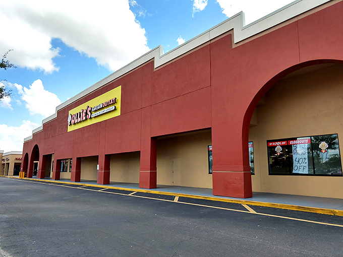 The unmistakable red exterior of Ollie's in Port Charlotte stands like a beacon of bargains against the Florida sky, promising treasures within.
