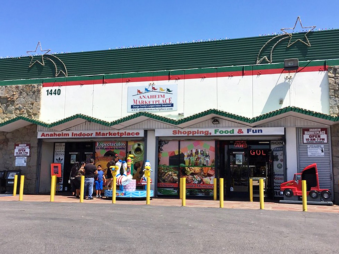 The unassuming exterior of Anaheim Marketplace hides a world of wonders within. Green trim and stone accents hint at the cultural treasures awaiting discovery inside.