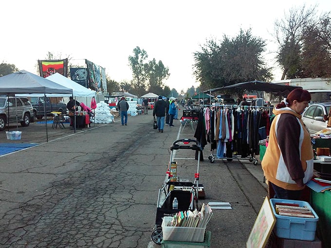 A shopper's paradise under canvas&mdash;where treasures await beneath blue-striped tents and California sunshine, proving one person's past is another's perfect find.