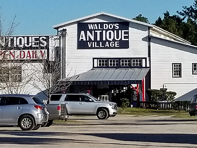 The iconic white buildings of Waldo's Antique Village stand like beacons for treasure hunters, promising daily doses of nostalgia and unexpected finds.