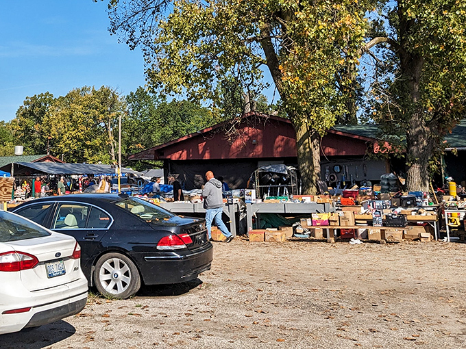 The iconic red barn serves as command central for treasure hunters, with tables of potential finds sprawling outward like a secondhand solar system.