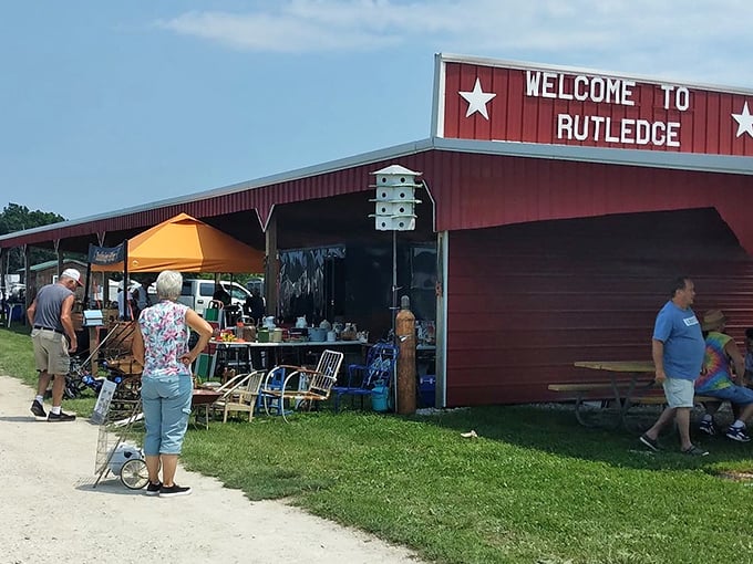 The iconic red "Welcome to Rutledge" sign stands as a beacon to bargain hunters, promising adventures in antiquing that Instagram filters simply can't replicate.