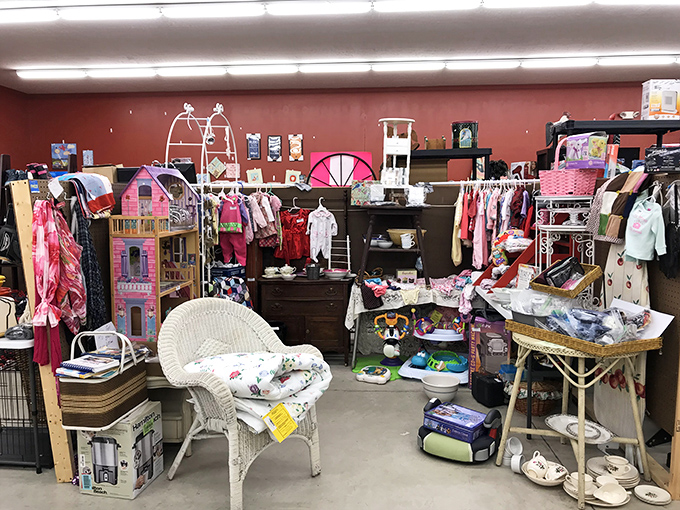A treasure hunter's paradise awaits! This colorful corner booth showcases everything from dollhouses to wicker chairs, each item whispering stories of its past life.