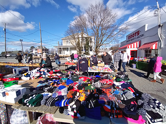 Treasure hunting begins! Tables laden with colorful clothing and knickknacks stretch across Root's outdoor market area, where one person's castoffs become another's discoveries.