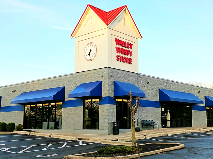 Valley Thrift Store's iconic clock tower and red-topped building stand like a beacon for bargain hunters. The blue awnings practically whisper "treasures await inside!"