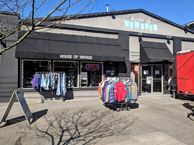 The unassuming exterior of House of Vintage belies the technicolor time machine waiting inside. Clothing racks spill onto the sidewalk like appetizers before the main course.