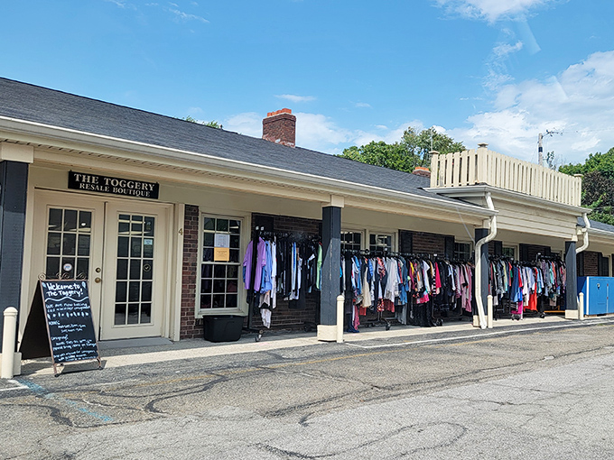 The brick-and-mortar equivalent of finding twenty bucks in your winter coat pocket. The Toggery's exterior promises treasure hunting with clothes already spilling onto the porch.