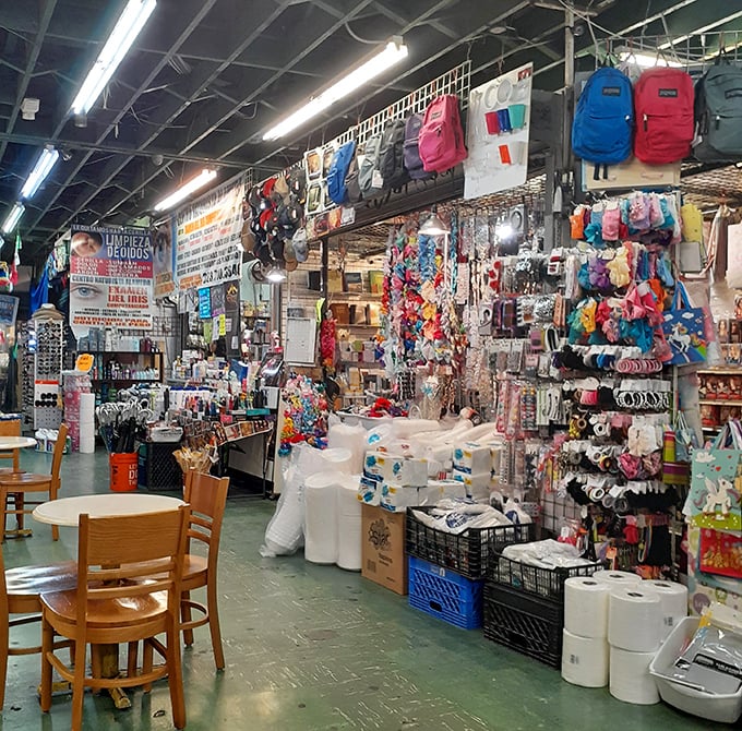 Inside this labyrinth of treasures, every aisle promises discovery. Backpacks dangle like colorful fruit while everyday necessities await at prices that won't break the bank.