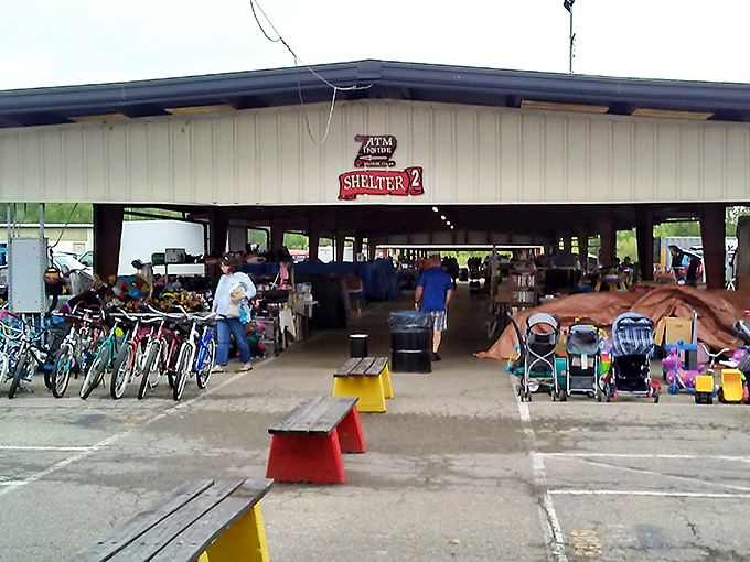 The main corridor stretches like a retail yellow brick road, promising treasures at every turn. Shoppers stroll beneath red beams, hunting for their next great find.