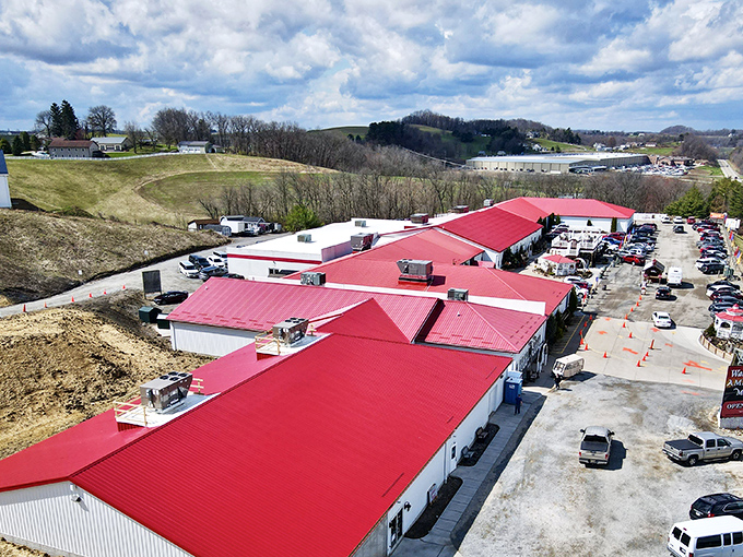 The iconic red roof of Walnut Creek Marketplace stands out against Ohio's rolling hills like a beacon for treasure hunters and bargain lovers alike.