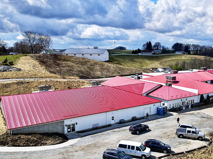The iconic red roof of Walnut Creek Marketplace stands out against Ohio's rolling hills like a beacon for treasure hunters and bargain lovers alike.
