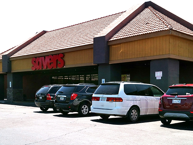 The iconic red Savers sign beckons like a lighthouse for bargain hunters, promising treasures within that won't break the bank.