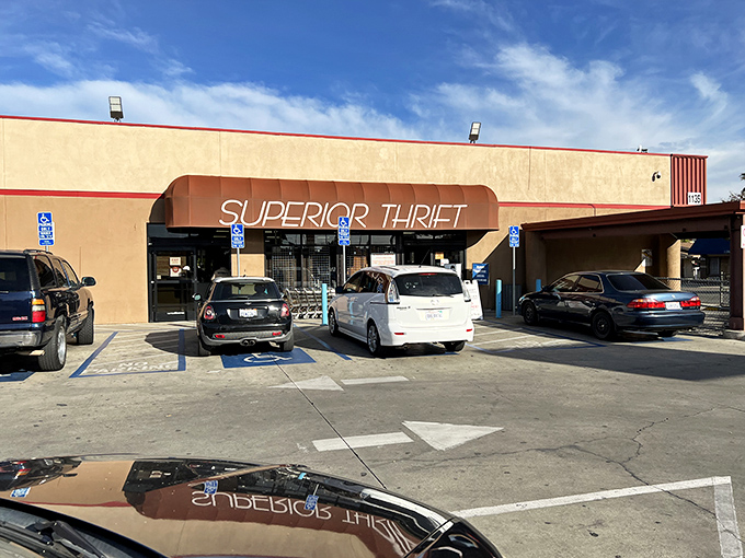 The unassuming exterior of Superior Thrift beckons with its orange awning and "New & Used" promise—a treasure cave disguised as a strip mall storefront.