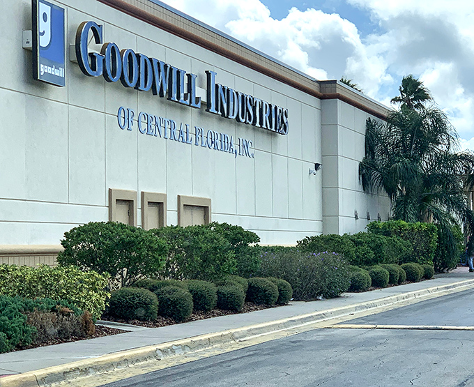 The unassuming exterior of Goodwill Industries of Central Florida belies the treasure trove waiting inside. Florida palm trees stand guard over this bargain hunter's paradise.