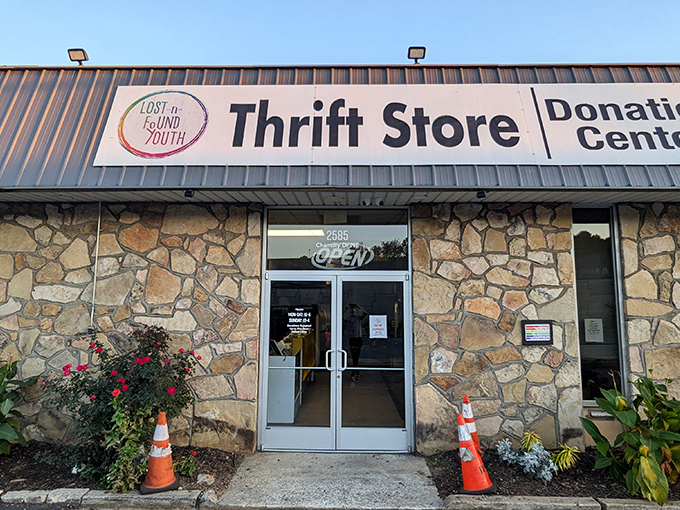 The stone facade of Lost-N-Found Thrift Store stands like a treasure chest waiting to be opened, promising bargains that'll make your wallet do a happy dance.