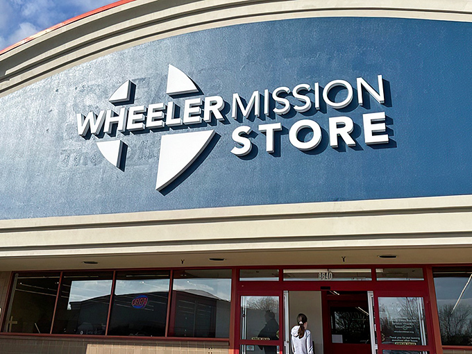The iconic blue and white Wheeler Mission Store facade stands as a beacon for bargain hunters across Indianapolis.