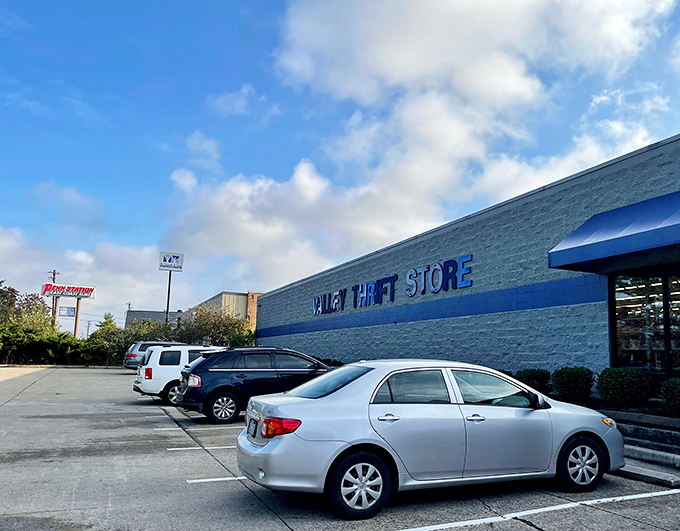 The blue-trimmed exterior of Valley Thrift Store stands like a beacon for bargain hunters, promising treasures within its unassuming walls.