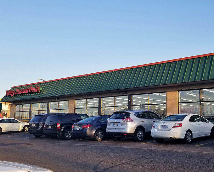 The unassuming exterior of Village Discount Outlet belies the treasure trove within. Like a bargain hunter's Narnia, this green-roofed wonderland awaits.