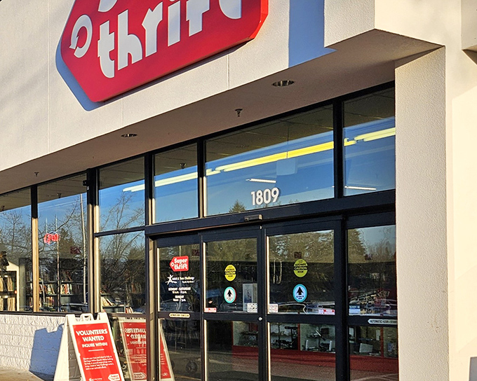 The iconic red SuperThrift sign welcomes bargain hunters like a beacon of hope for both wallets and vintage-lovers alike.