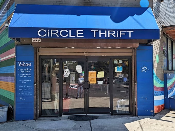 The blue awning beckons like a portal to bargain paradise. Circle Thrift's vibrant storefront stands out in Philadelphia's urban landscape, promising treasures within.