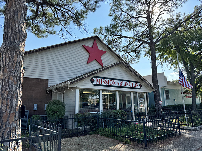 The iconic red star atop Mission Arlington welcomes bargain hunters like a North Star for thrift enthusiasts. This unassuming exterior hides a treasure trove within.