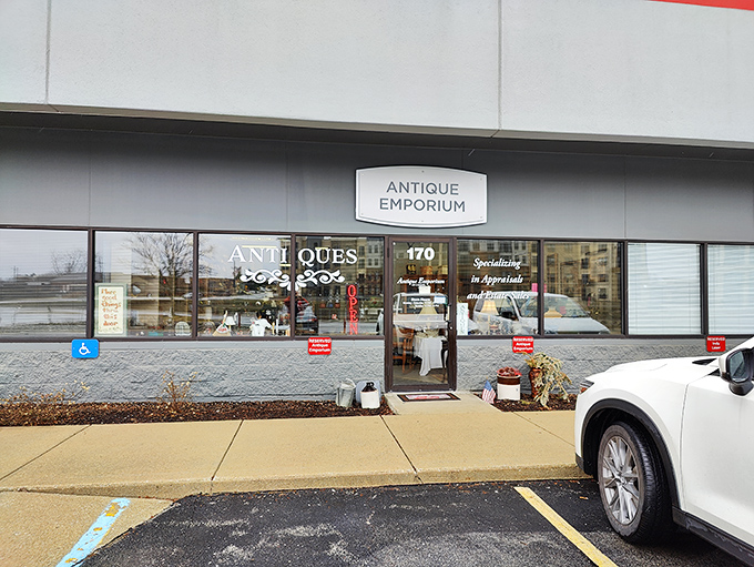 The unassuming exterior of Antique Emporium in Carmel hides a wonderland of treasures within, like finding Narnia behind a department store facade.